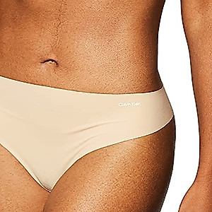 Calvin Klein Women's Invisibles No Panty Line Thong Panty, Light caramel, Small