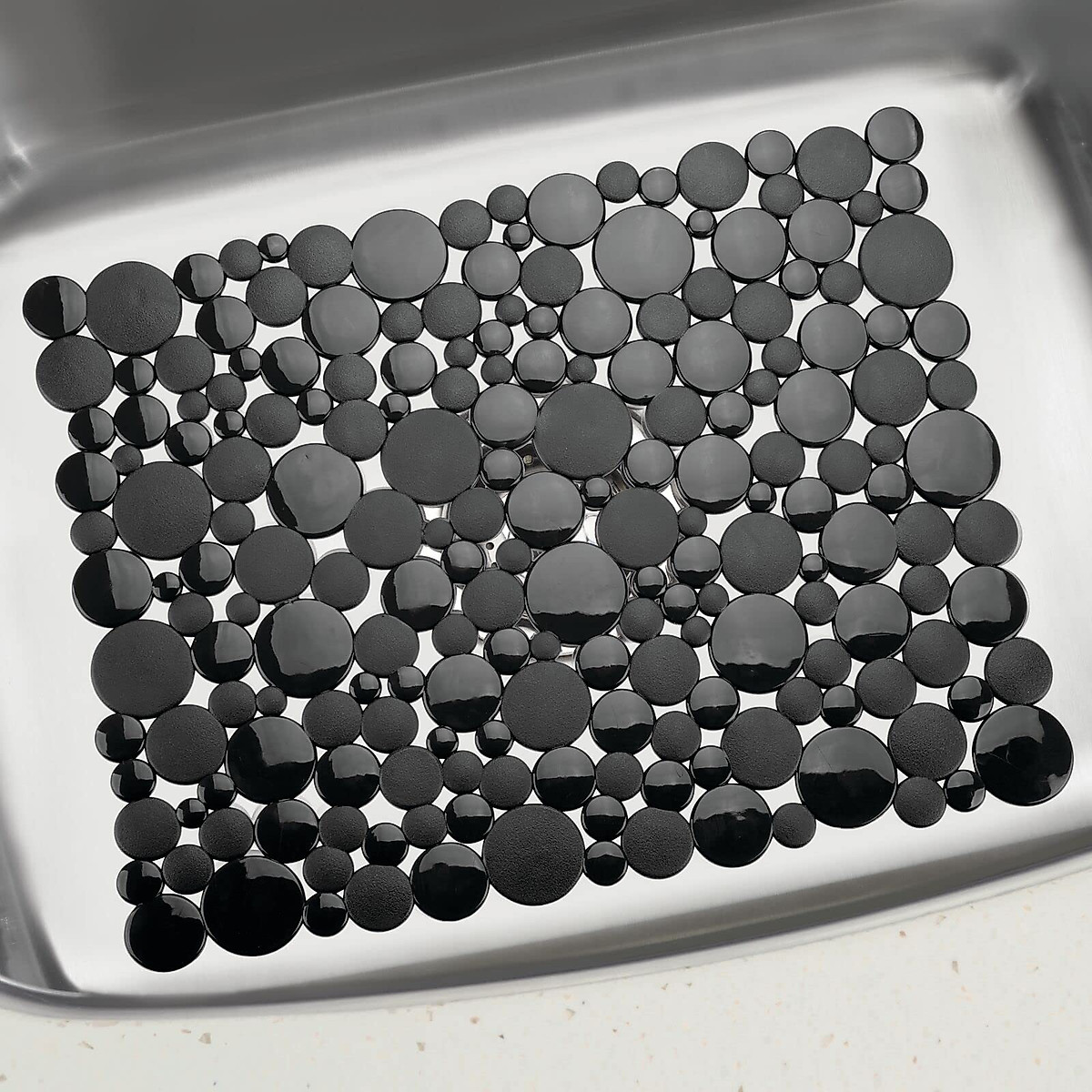 mDesign Decorative Kitchen Plastic Sink Protector Set, Quick Draining - Protect Surfaces and Dishes - Modern Bubble Design - Includes 1 Saddle, 2 Large Mats - Set of 3 - Black