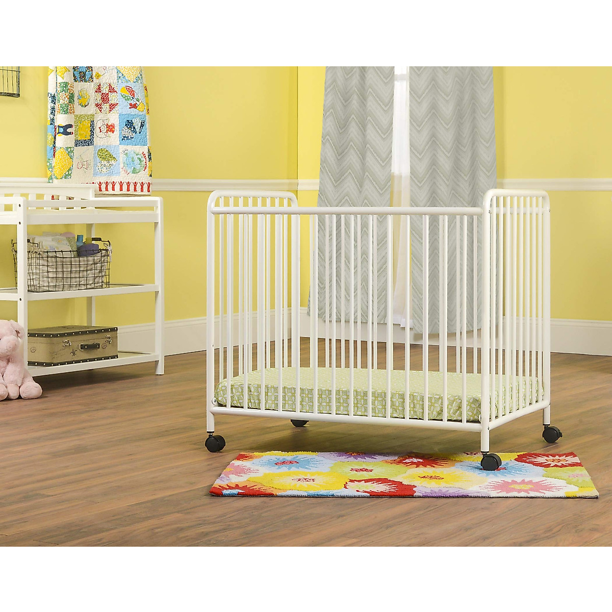 Child Craft Siesta Metal Compact Non-Folding Portable Crib with 2” Crib Mattress and Locking Wheels, Durable Metal Construction, Easy to Clean (White)