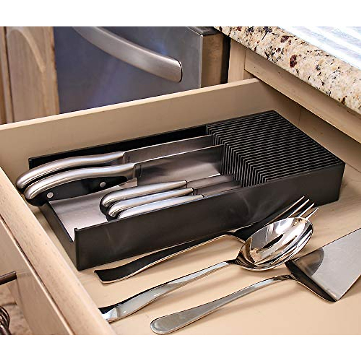 Plastic KNIFEdock - In-Drawer Knife Storage for your kitchen. Replace your knife block with a revolutionary product. Clear your counter top of clutter, and easily identify the desired knife. KNIFEdock