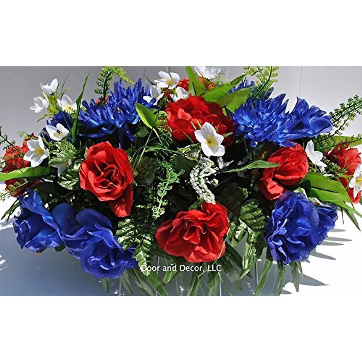 Summer Patriotic Cemetery Flowers with Red Roses, Blue Spider Mums, Blue Roses, and White Forget-me-nots headstone saddle arrangement