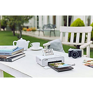 Canon SELPHY CP1300 Wireless Compact Photo Printer (White) RP-108 Color Ink Paper Set (108 Sheets of 4 x 6 Paper) + NeeGo Printer Cable + NeeGo Print Protector (100 Pack)