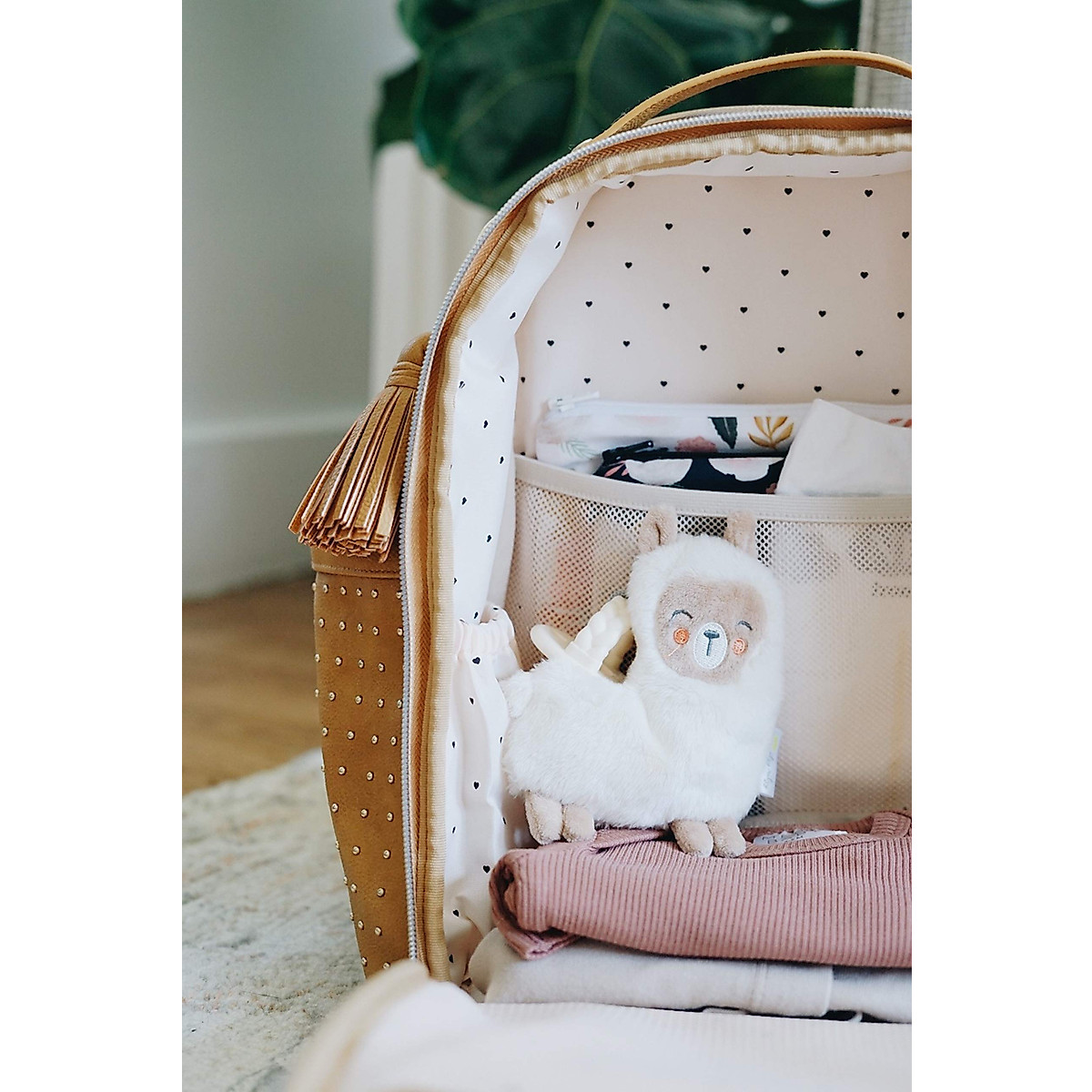 Itzy Ritzy Chelsea + Cole Mini Diaper Bag Backpack - Studded Mini Backpack with Changing Pad, 8 Pockets, Rubber Feet & Tassel - Caramel with Sweetheart Print Interior and Gold Hardware