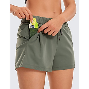 CRZ YOGA Stretch Shorts for Women Work Casual 2.5'' - Athletic Shorts with Pockets for Workout Travel Hiking Golf Grey Sage Medium