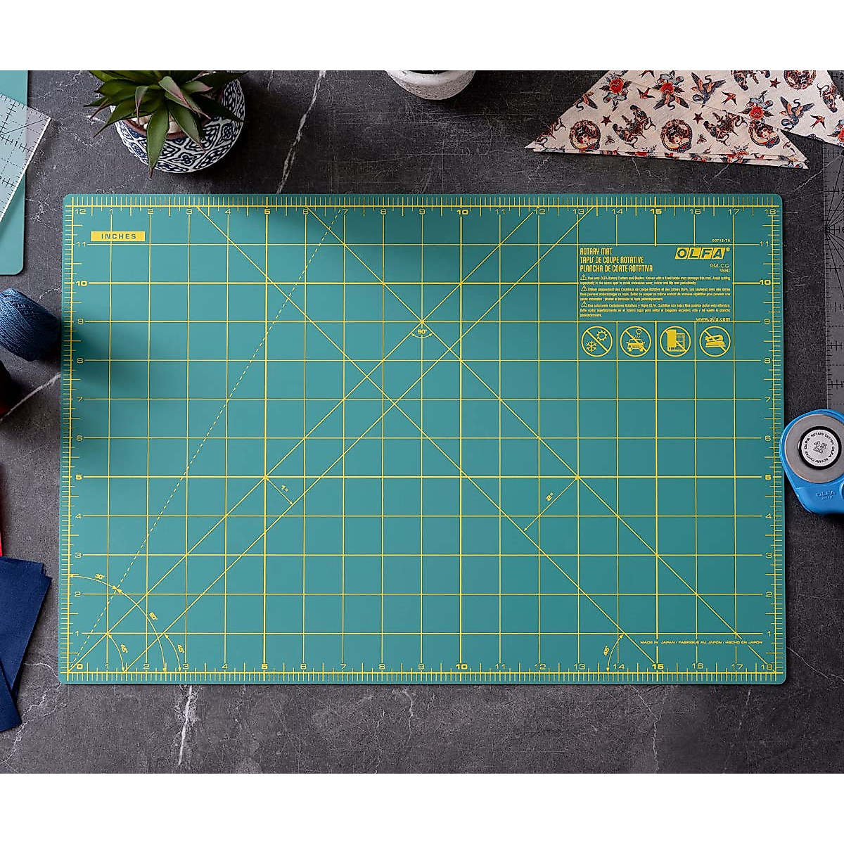 OLFA 12" x 18" Self Healing Rotary Cutting Mat (RM-CG) - Double Sided 12x18 Inch Cutting Mat with Grid for Quilting, Sewing, Fabric, & Crafts, Designed for Use with Rotary Cutters (Green)