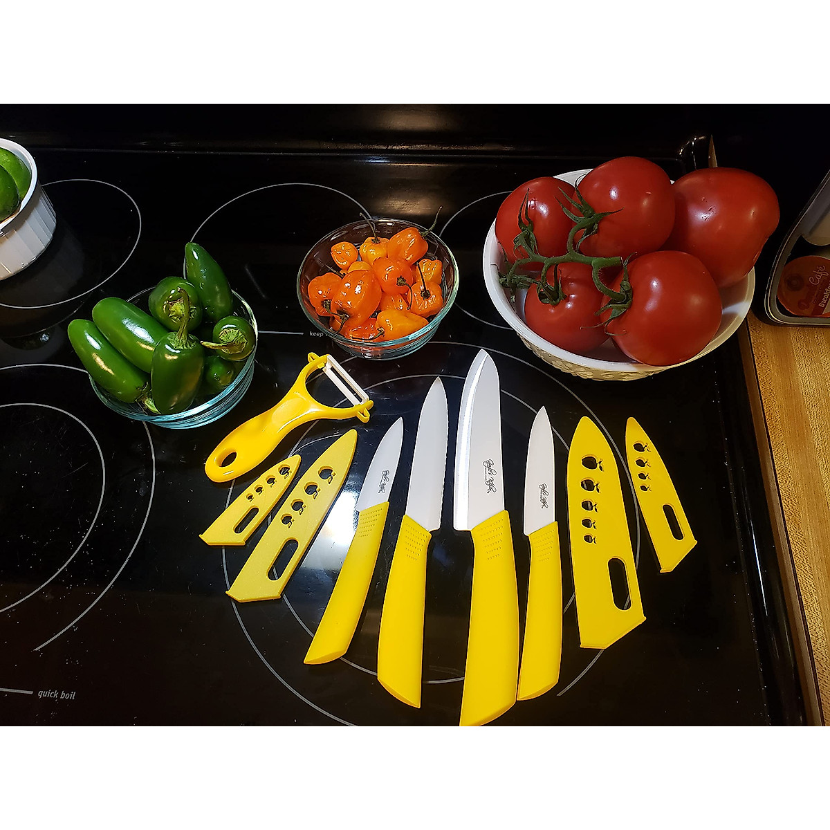 Serrated Black Ceramic Knife Set with 5" Serrated Knife. Includes 3”, 4”, 5”, 6” Ceramic Knives, Matching Sheaths and a Matching Vegetable Peeler in a Black Gift Box
