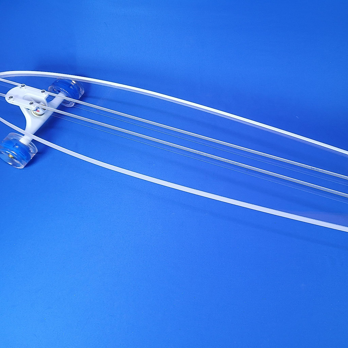 Clear Longboard with Light Up LED Wheels, 48" Pintail Riptide. Acrylic clear skatboard for all ages. weight limit 230 lbs. Made in USA