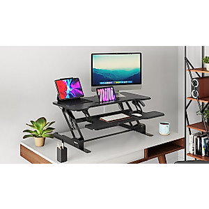 Mount-It! Height Adjustable Standing Desk Converter, 38” Wide, Stand Up Desk Riser for 2 Monitors, Manual Gas Spring Desktop Raises to 16.9", Fits Two Monitor Screens with Keyboard Mouse Tray in Black