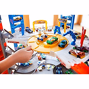 Hot Wheels Toy Car Track Set & 4 1:64 Scale Cars, Super Ultimate Garage, 3+ Ft Tall with Motorized Gorilla & Storage for 140 Cars
