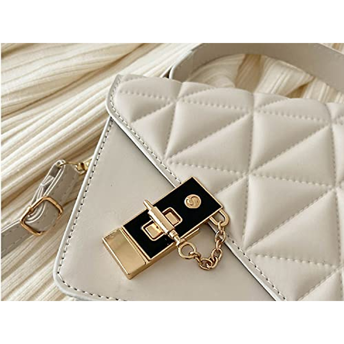 Ladies crossbody leather handbag in three classic colors with a creative geometric design and a small buckle chain closure.  (White)