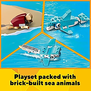 LEGO Creator 3-in-1 Surfer Beach House 31118 - Featuring Lighthouse, Pool House, Boat, 2 Minifigures, Dolphin Figure, Great Summer Building Toy Set for Kids, Girls, and Boys Ages 8+