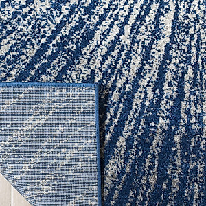 SAFAVIEH Evoke Collection Area Rug - 9' x 12', Navy & Ivory, Abstract Burst Design, Non-Shedding & Easy Care, Ideal for High Traffic Areas in Living Room, Bedroom (EVK228N)