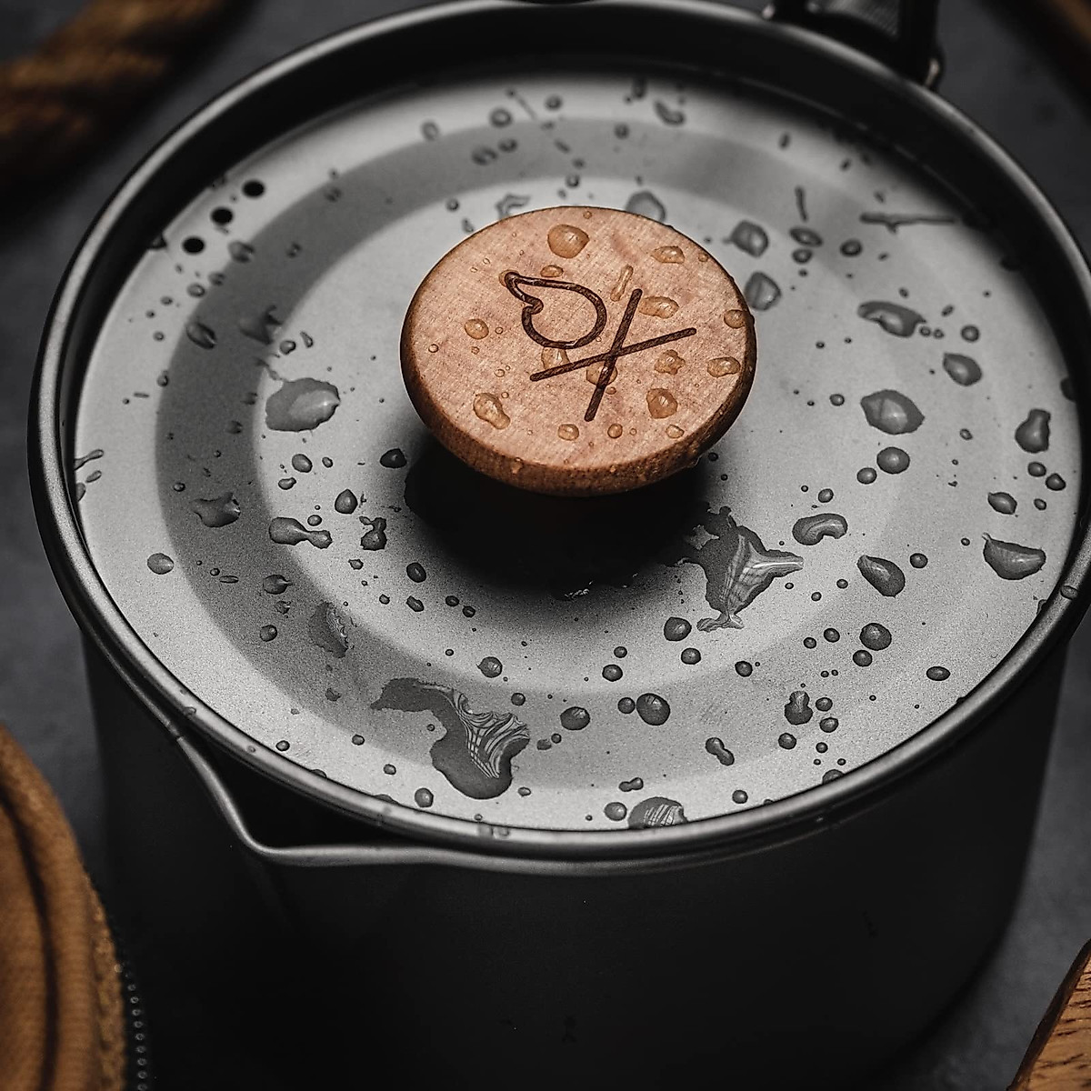 Überleben Kessel - Camping Kettle Pot with 37Fl Oz (1.1L) Capacity, Hanger Handle, Natural Hardwood Grip, Locking Lid, & Steam Vents - Available in Stainless Steel or Titanium - Includes Canvas Bag