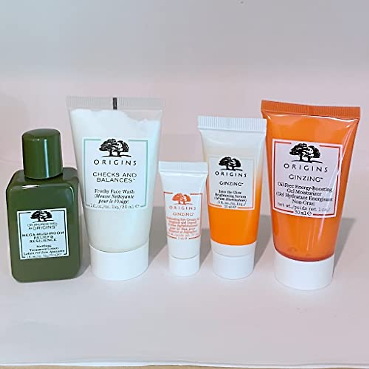 Origins Ginzing Travel Set. Ginzing Oil-Free Energy-Boosting Gel Moisturizer 1.0oz, Eye Cream .17oz & Ginzing Serum 0.5oz, Checks and Balances Face Wash 1oz & Mega Mushroom Toner 1oz