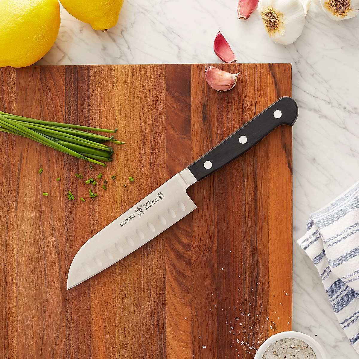 HENCKELS Classic Razor-Sharp 5-inch Hollow Edge Santoku Knife, German Engineered Informed by 100+ Years of Mastery