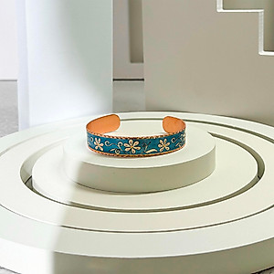 Women's Daisy Flower Bracelets feature a beautiful daisy flower on a blue copper cuff with an open-ended flower cuff design. These copper bracelets are adjustable for a perfect fit—BNF-06.