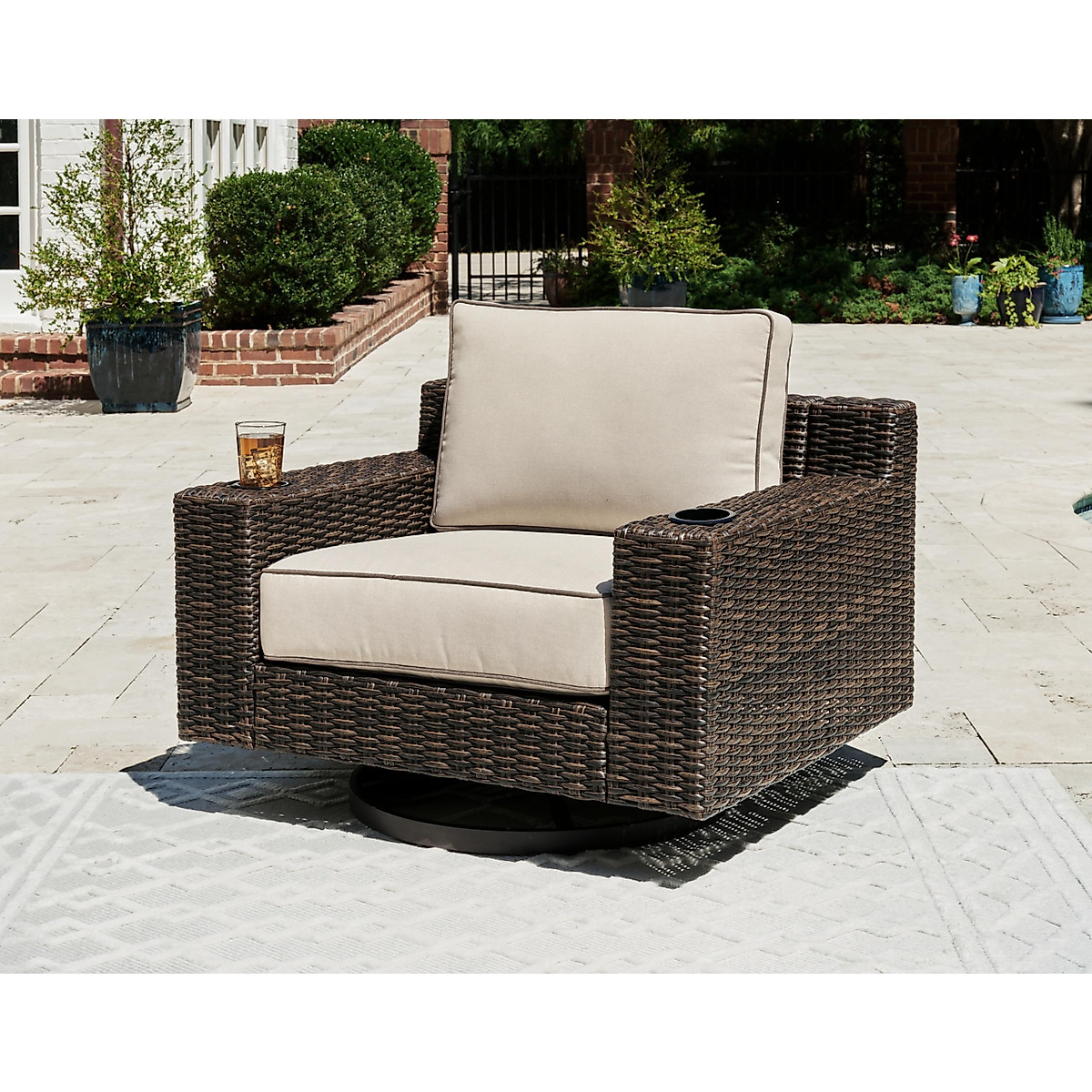 Signature Design by Ashley Coastline Bay Casual Outdoor Swivel Lounge with Cushion and 2 Cup Holders, Beige & Dark Brown
