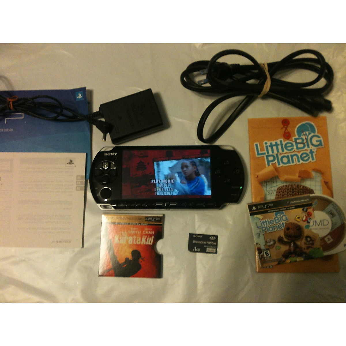PlayStation Portable 3000 with LittleBigPlanet, The Karate Kid [UMD for PSP], and 1GB Memory Stick PRO Duo - 2010 Black Friday Bundle