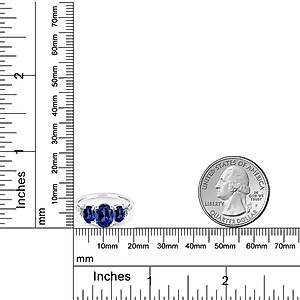 Gem Stone King 10K White Gold Oval Blue Created Sapphire and Diamond Accent 3-Stone Women Engagement Ring (2.65 Cttw) (Size 5)