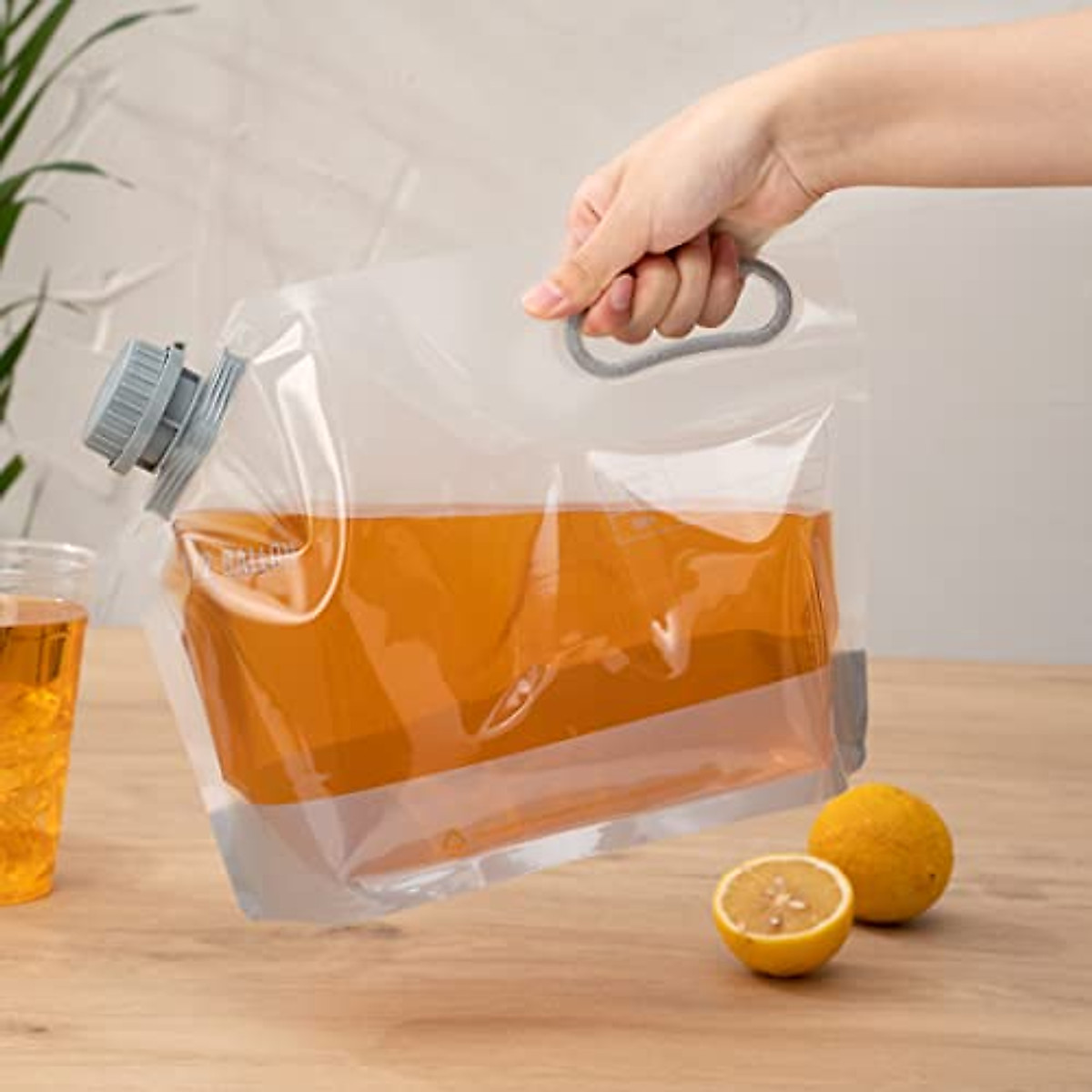 Restaurantware Cater Tek 1/2 Gallon Water Containers 10 Drink Bags - Collapsible Includes Tamper-Evident Caps Clear Plastic Beverage Bags For Catered Events Camping or Hiking Durable Handle