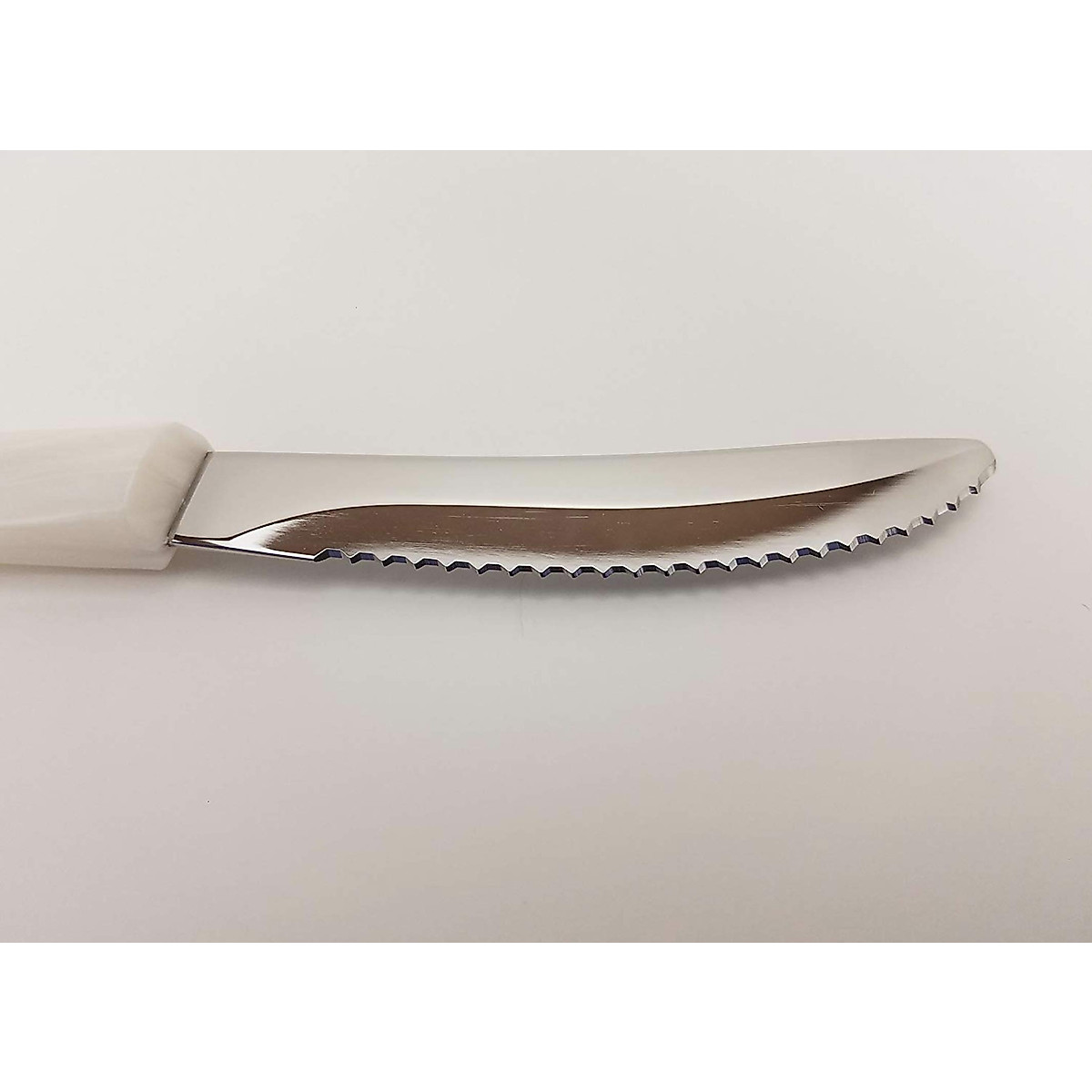 CUTCO Model 1759 Table Knife with White (Pearl) handle....................3.4” High Carbon Stainless DD serrated blade.............in factory sealed plastic bag.
