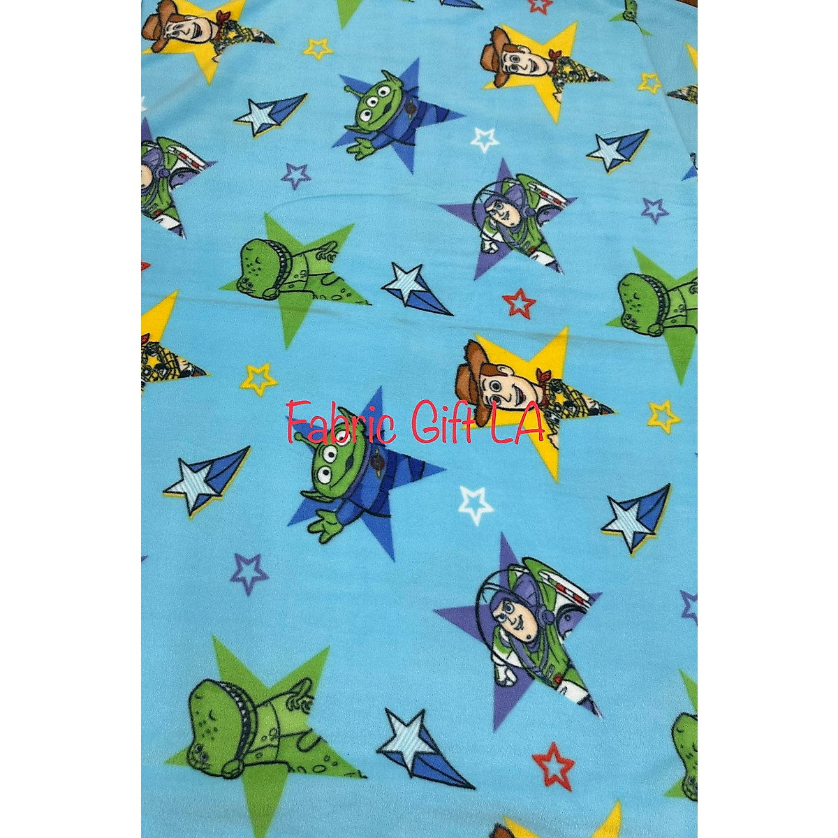 Disney Toy Story 4 Character Stars on Sky Blue Fleece from Springs Creative Buzz Light Year and Woody Fabric by The Yard