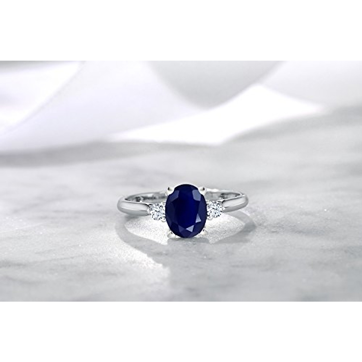 Gem Stone King 10K White Gold Blue Sapphire and White Created Sapphire 3-Stone Engagement Ring | 1.89 Cttw | 3 Stone Wedding Engagement Anniversary Promise Ring For Women (Size 9)