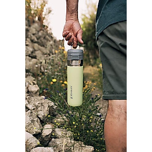 Stanley Quick Flip GO Water Bottle 24 oz | Push Button Lid | Leakproof and Packable for Travel and Sports | Insulated Stainless Steel | BPA-Free | Pomelo