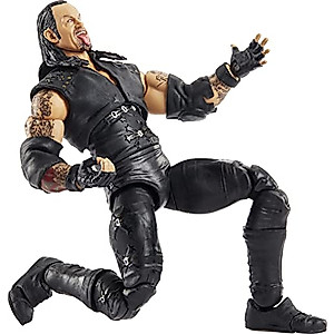 WWE Ultimate Edition Undertaker Action Figure, 6-inch Collectible with Extra Heads, Swappable Hands & WrestleMania XIV Entrance Jacket for Ages 8 Years Old & Up