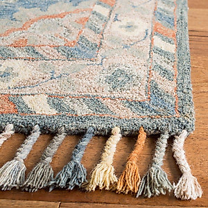 SAFAVIEH Aspen Collection Area Rug - 10' x 14', Blue & Rust, Handmade Boho Braided Tassel Wool, Ideal for High Traffic Areas in Living Room, Bedroom (APN123A)