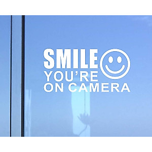 (2 Pack) 7"x3.5" White - Smile You're On Camera - UV Resistant, Waterproof, Peel & Stick Decor Decal Sticker Quote Adhesive Vinyl Mural Art Script Lettering - For storefronts, cars, trucks, boats, etc