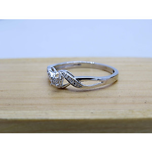 Dazzlingrock Collection Round White Diamond Crossover Swirl Promise Engagement Ring for Women (0.06 ctw, Color I-J, Clarity I2-I3) in 925 Sterling Silver Size 7