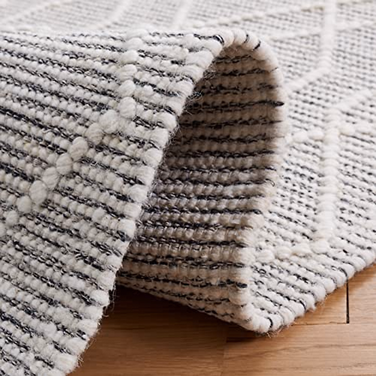 Safavieh Natura Collection Accent Rug - 4' x 6', Ivory & Black, Handmade Boho Geometric Braided Tassel Wool, Ideal for High Traffic Areas in Entryway, Living Room, Bedroom (NAT323A)