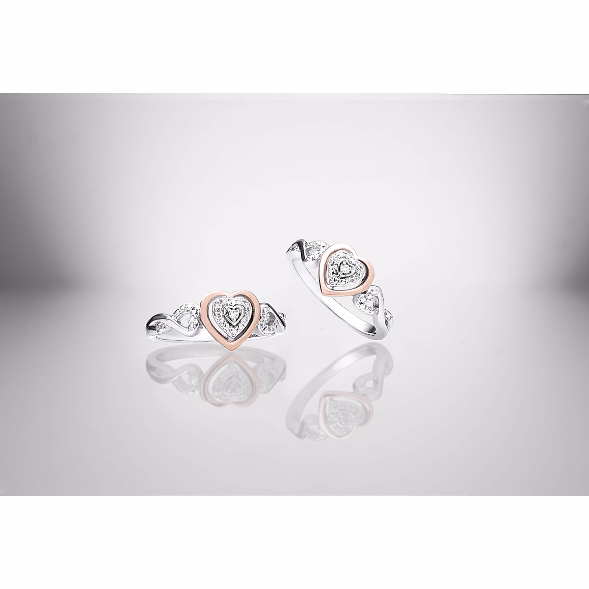 14K Rose Gold Plated .925 Sterling Silver Diamond Accented Three Heart Infinity Promise Ring (I-J Color, I2-I3 Clarity) - Size 5