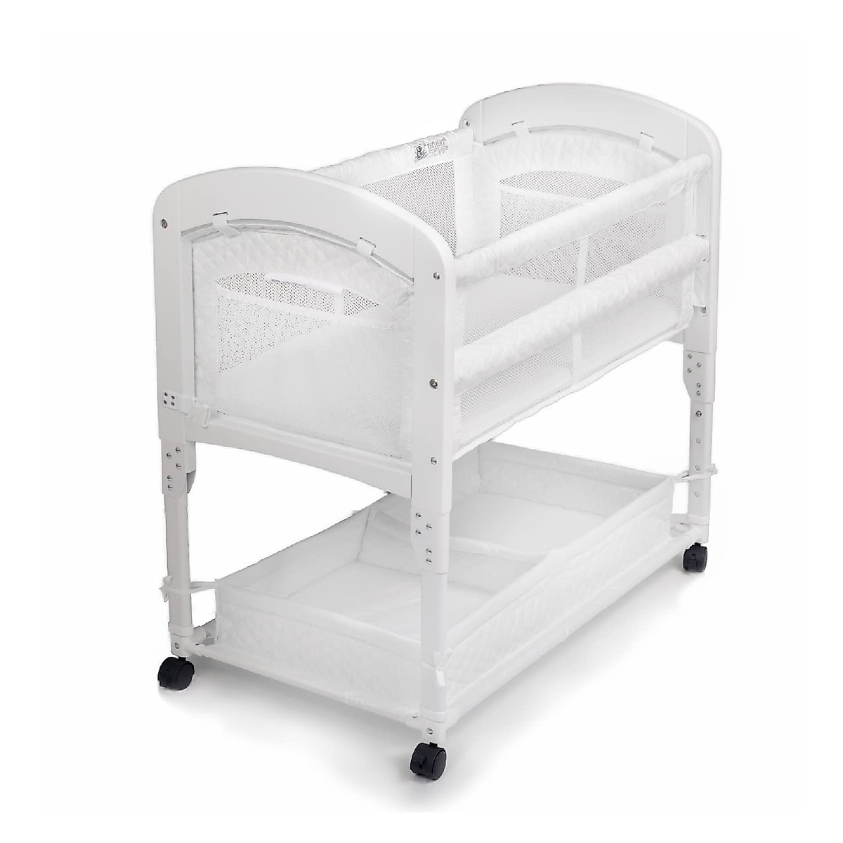 Arm’s Reach Cambria Co-Sleeper Bedside Bassinet Featuring Height-Adjustable Legs, Curved Wooden Ends, Breathable Mesh Sides with Pockets, and Large Lower Storage Basket, White