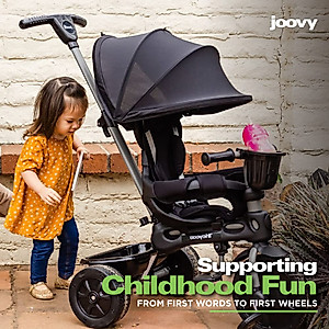 Joovy 4.1 Kids Tricycle with 4-Stages Featuring Extra-Wide Front Tire, Removable and Adjustable Parent Handle, Safety Harness, Machine-Washable Seat Pad, and Retractable Canopy (Black)