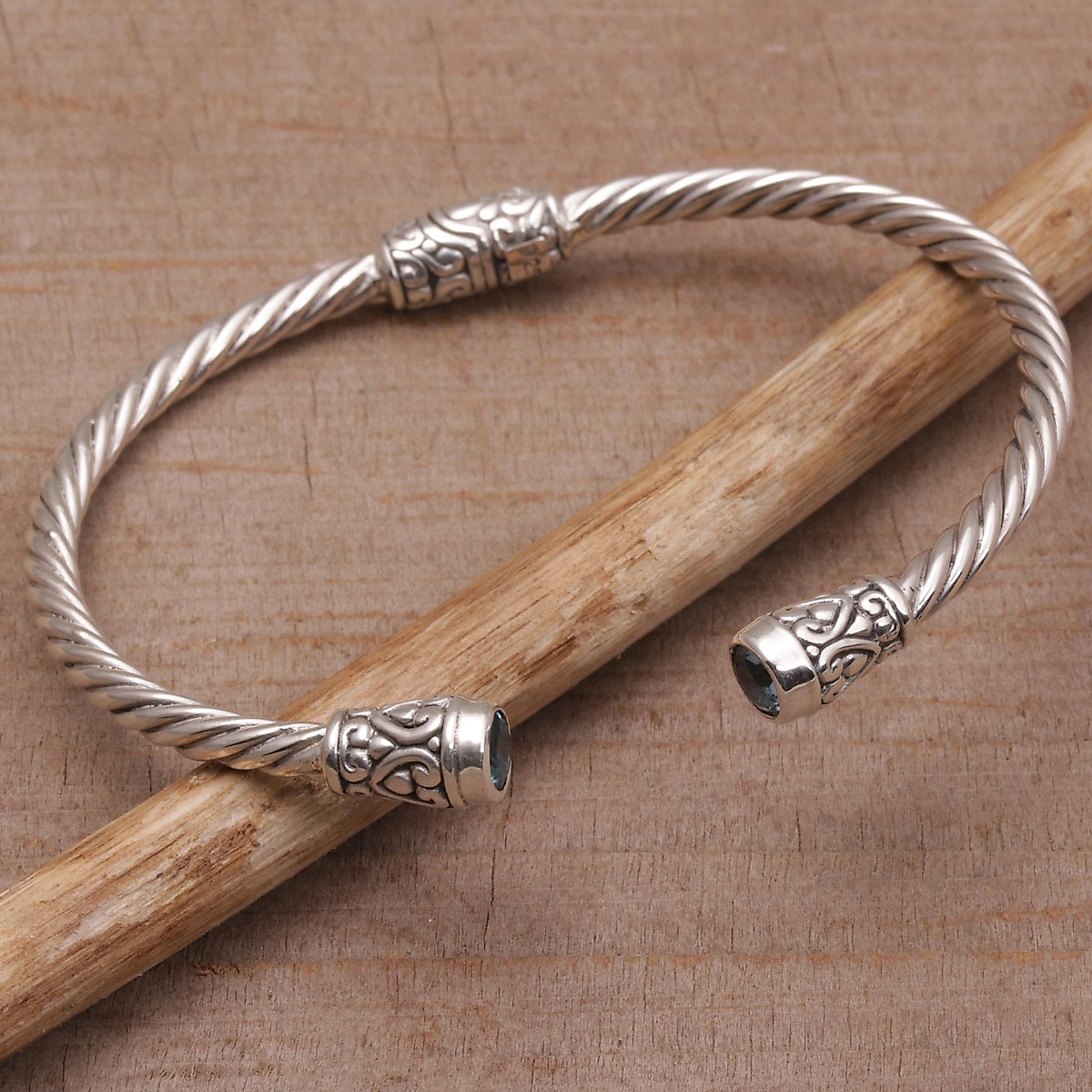 NOVICA Artisan Handmade Blue Topaz Cuff Bracelet Sterling Silver from Bali Indonesia Birthstone [6 in L (end to End) x 0.2 in W] ' Spiral Temple'