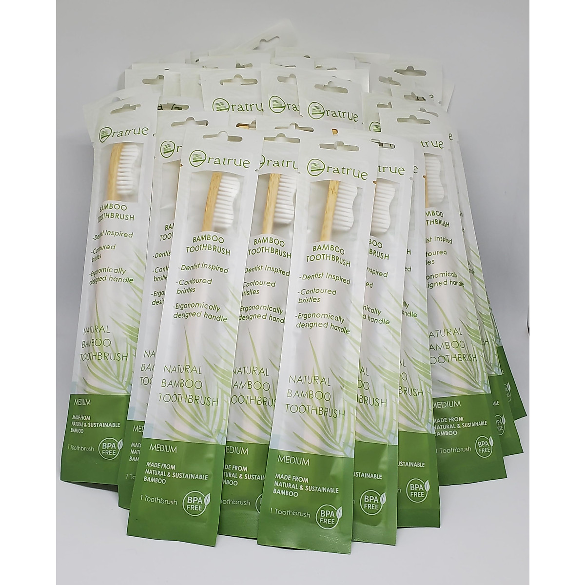 Oratrue Pack of 25 Bamboo Toothbrushes Medium Bristles US Company Packaged Individually Packaged Dentist Created UV Light Exposed