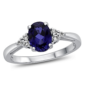 FJC Finejewelers 10k White Gold 8x6mm Oval Created Blue Sapphire and White Topaz Ring Size 7.5