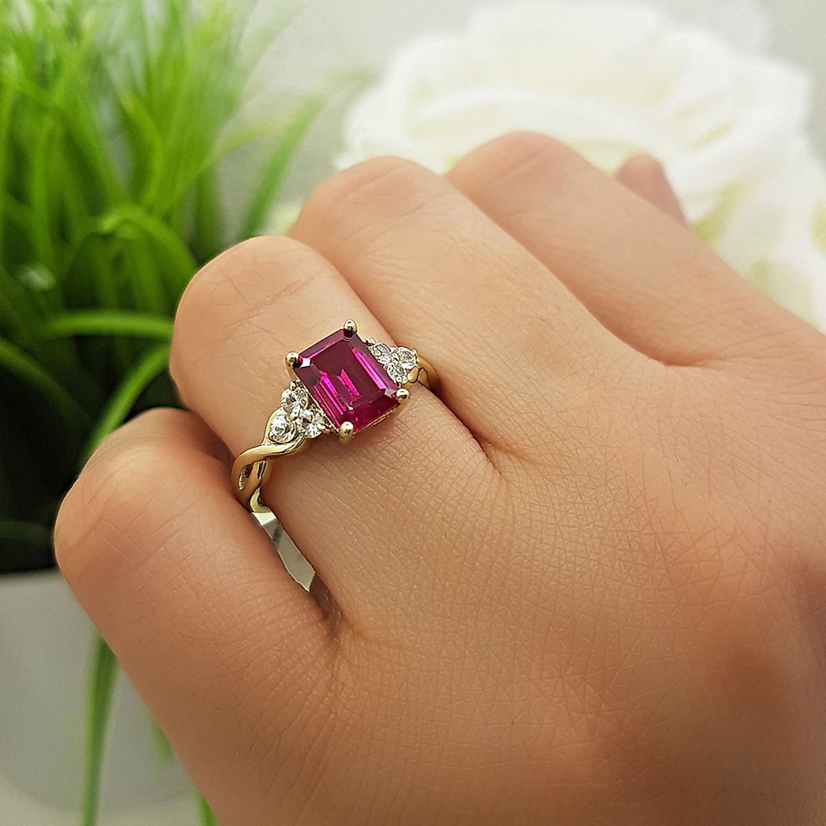 Dazzlingrock Collection 8x6mm Emerald Shape Center Lab Created Ruby & 2.2mm Round White Sapphire on Side Crisscross Shank Engagement Ring for Her in 10K Yellow Gold Size 7