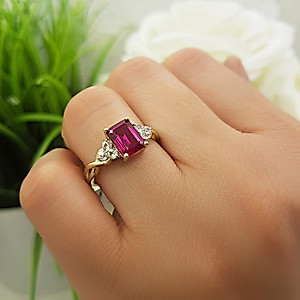 Dazzlingrock Collection 8x6mm Emerald Shape Center Lab Created Ruby & 2.2mm Round White Sapphire on Side Crisscross Shank Engagement Ring for Her in 10K Yellow Gold Size 7