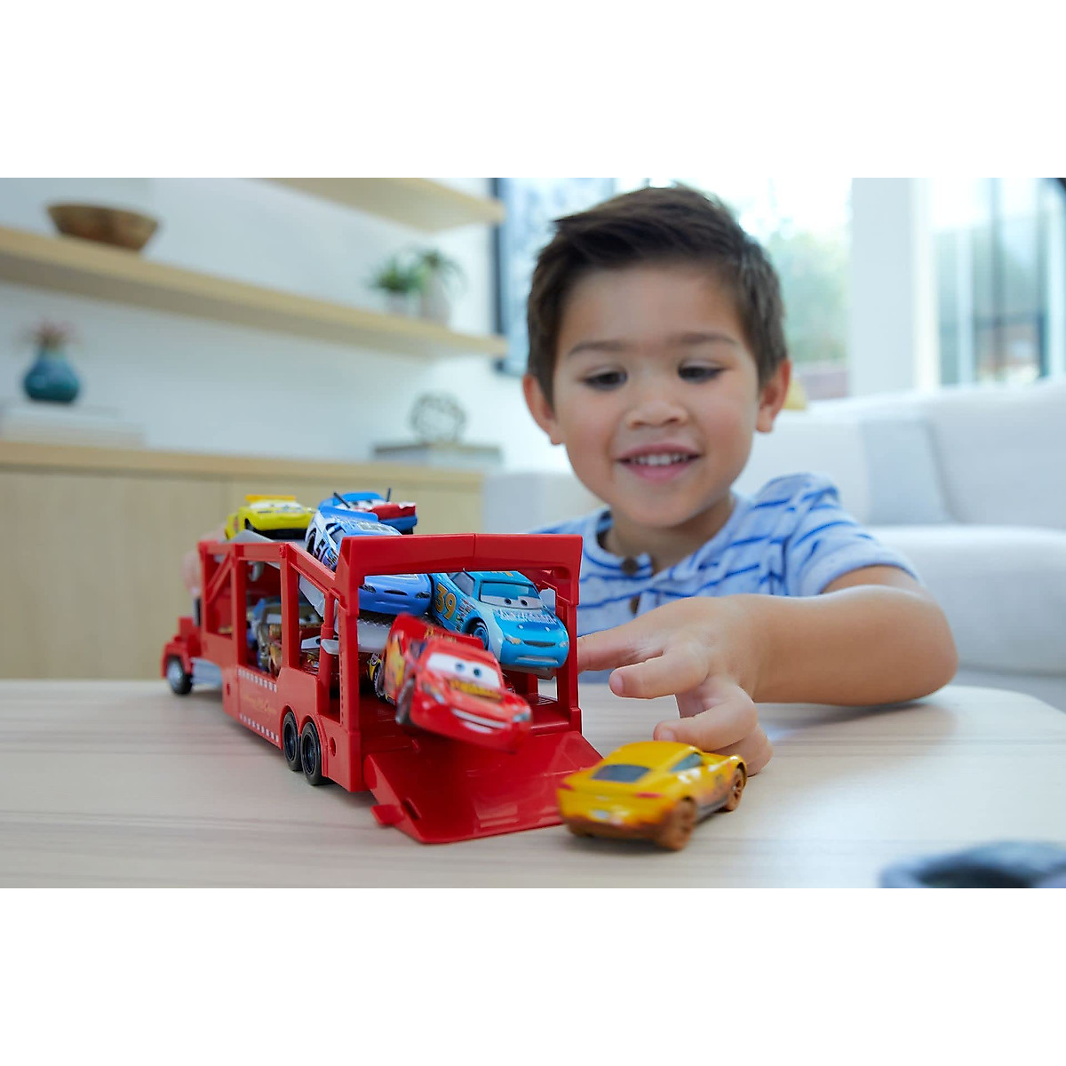 Mattel Disney and Pixar Cars Mack Hauler, 13-inch Toy Transporter Truck with Ramp & Carry Storage for 12 Vehicles