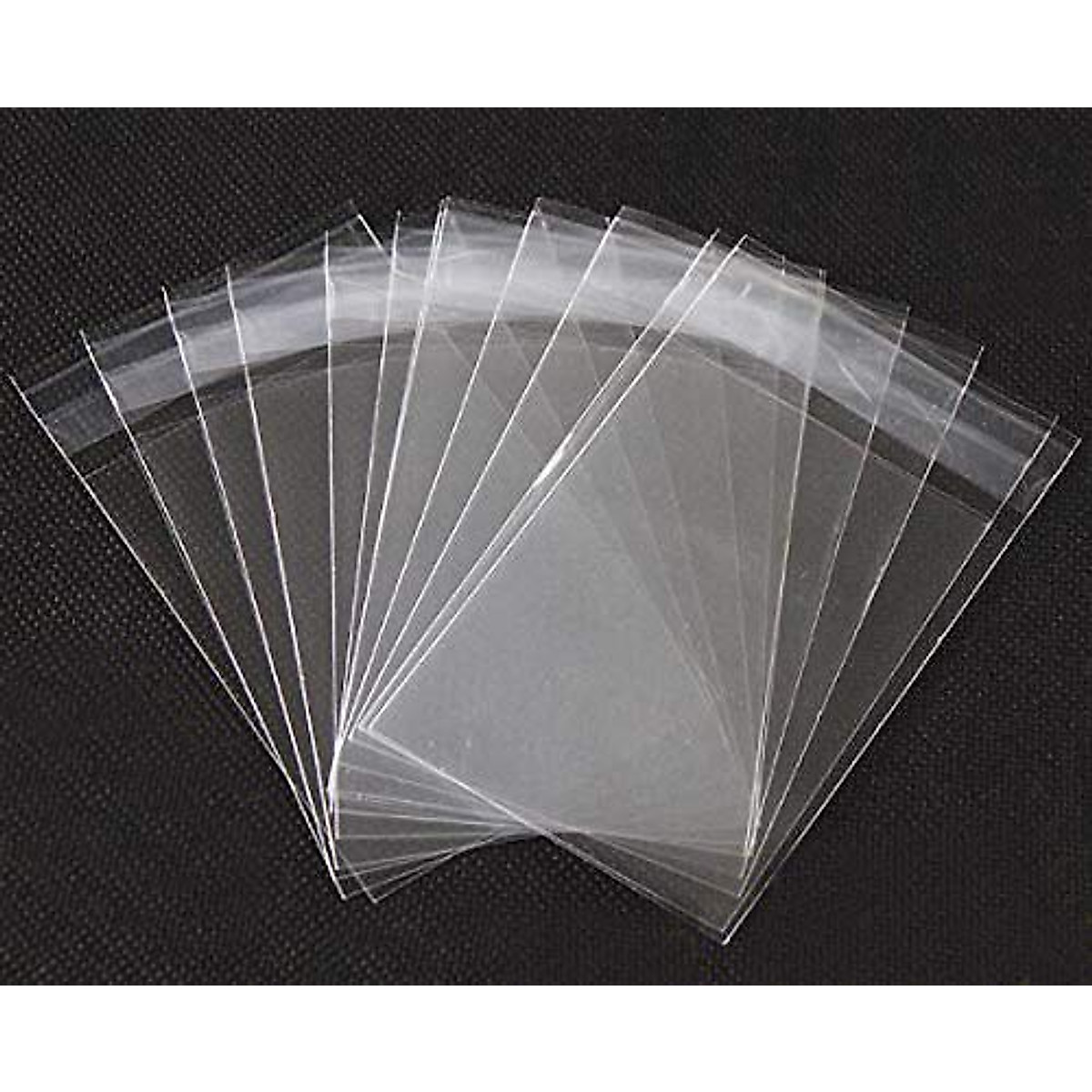 ericotry 100Pcs Clear Resealable Cello / Cellophane Bags Treat Bag Packaging Bags with Adhesive Closure Good for Bakery Candle Candies Cookies Snacks Poly Bags (9" X 12")