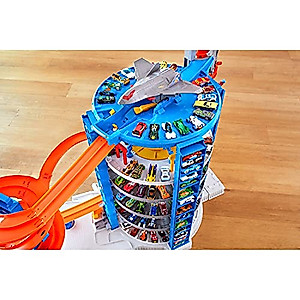 Hot Wheels Toy Car Track Set & 4 1:64 Scale Cars, Super Ultimate Garage, 3+ Ft Tall with Motorized Gorilla & Storage for 140 Cars