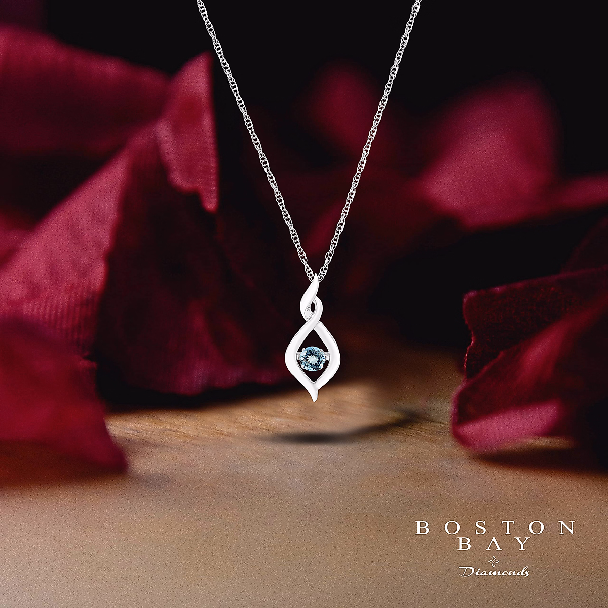 Boston Bay Diamonds .925 Sterling Silver & Blue Aquamarine Infinity Twist Dancing Brilliance in Motion Pendant Necklace with Rope Chain - 18”