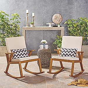 Christopher Knight Home Andy | Outdoor Acacia Wood ocking Chair with Water-Resistant (Set of 2), Teak Finish/Cream Cushion