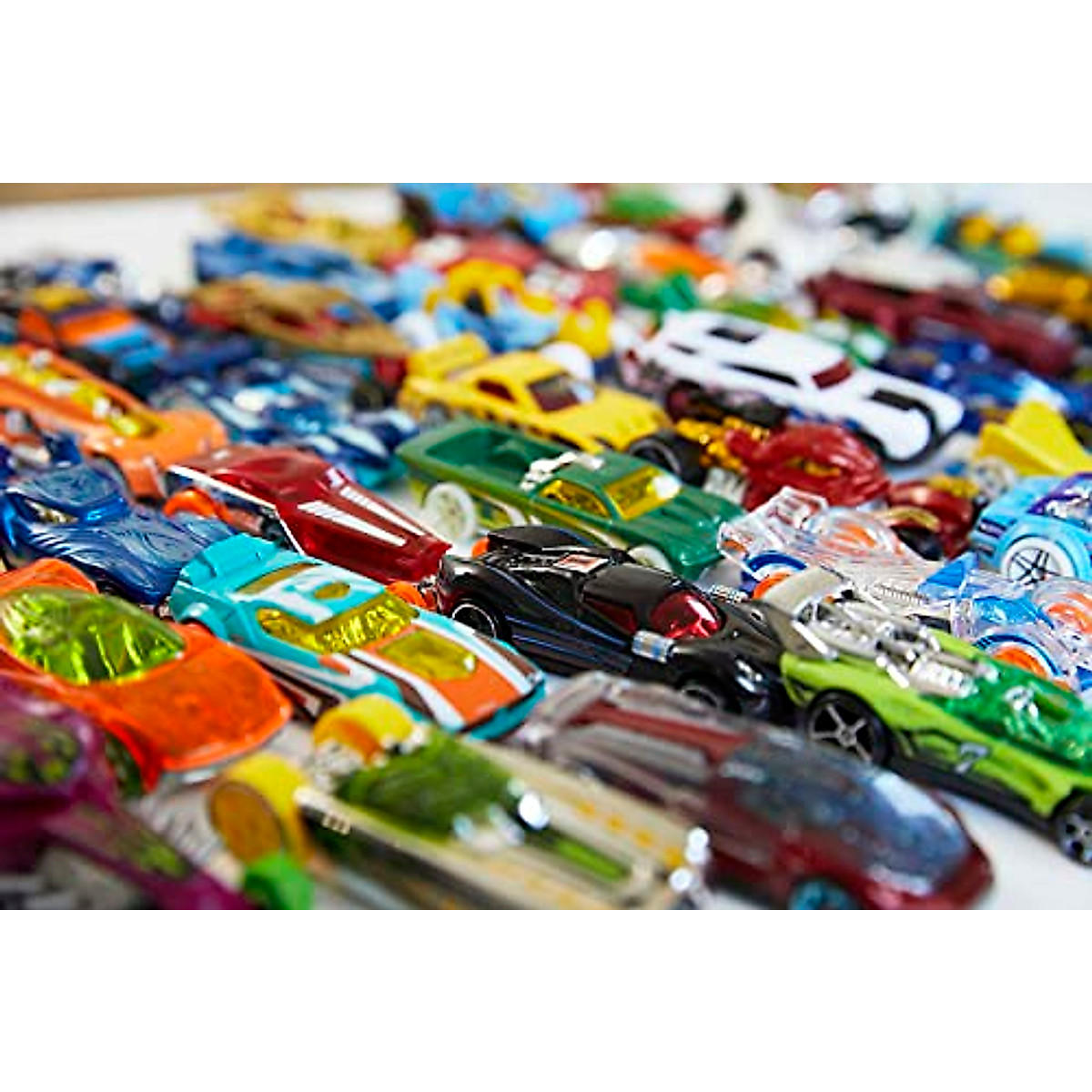 Hot Wheels Basics Black Box, 16 First-Appearance Toy Cars in 1:64 Scale, Possibly Includes a Treasure Hunt Car, Toy for Collectors & Kids 3 Years Old & Older