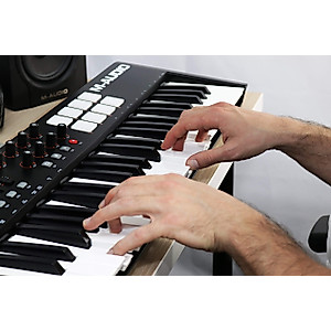 Oxygen 61 MK IV - 61-Key USB MIDI Drum Pad and Keyboard Controller (Renewed)