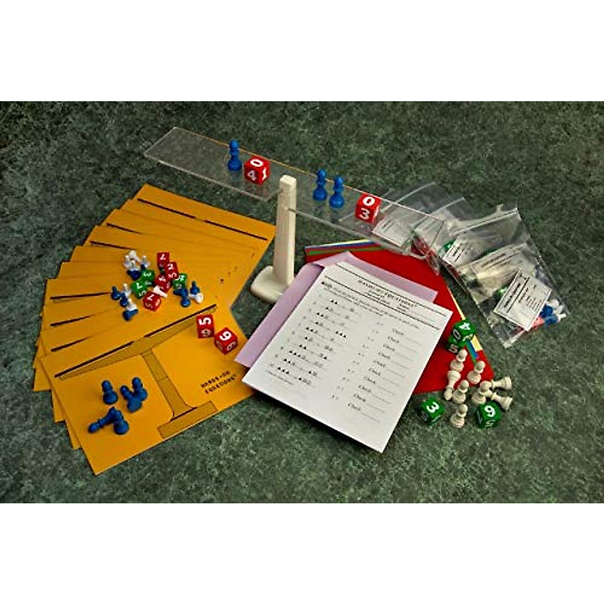 Hands-On Equations® Class Set for Teacher and 20 Students. Includes The Teacher Demonstration Balance Scale and Game Pieces and 20 Sets of Student Manipulatives. Grade 3 and up.