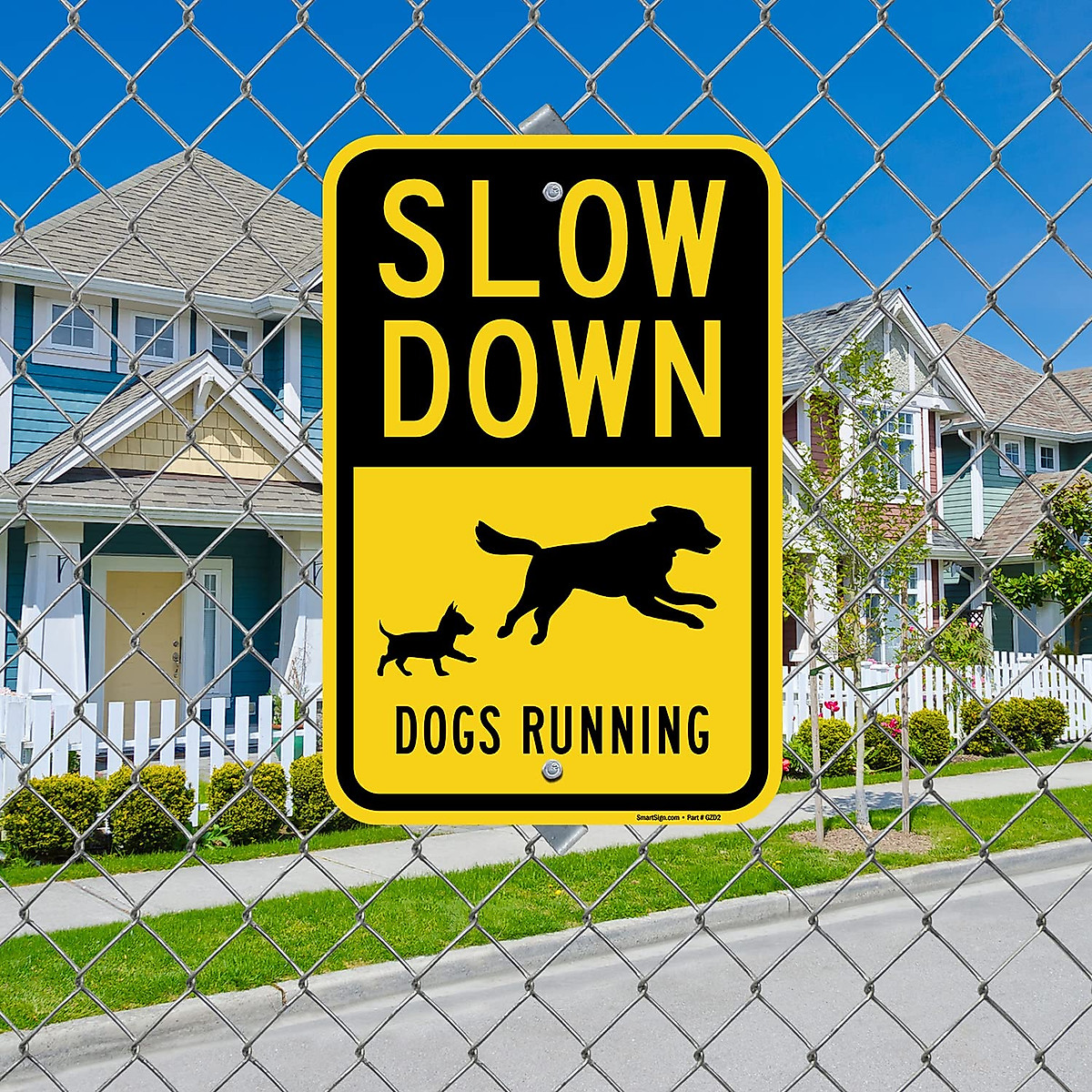 SmartSign 18 x 12 inch “Slow Down - Dogs Running” Metal Sign with Symbols, 63 mil Laminated Rustproof Aluminum, Black and Yellow, Made in USA
